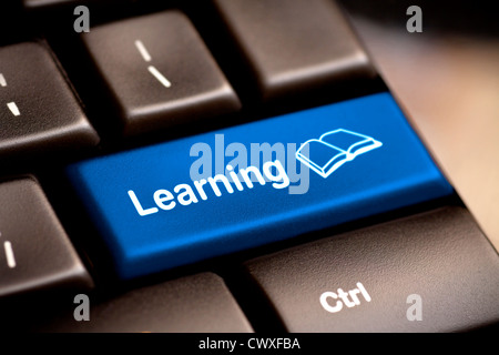 Distance learning on black keyboard with green key Stock Photo - Alamy