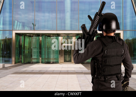 Military defending a business building Stock Photo - Alamy