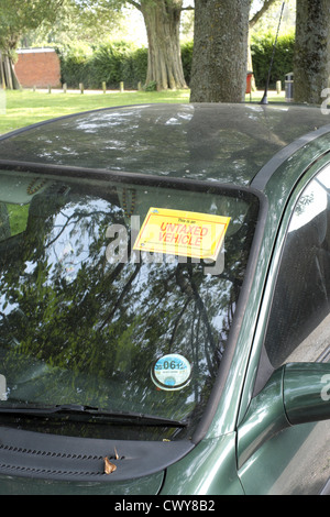 UK Untaxed Vehicle sticker on the windscreen of a parked car Stock ...