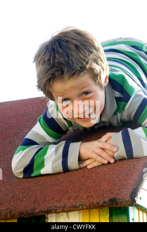 Vertical low angle shot of a blond cheerleader looking at the camera ...