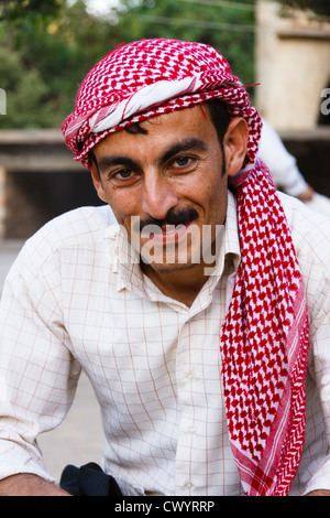 A portrait of a young Yezidi Kurdish man, who belongs to a persecuted ...