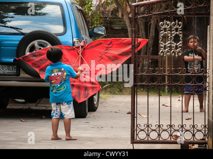 Child playing with kite Stock Photo - Alamy