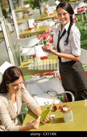 Young pensive woman waiting for her order in a cafe Stock Photo - Alamy