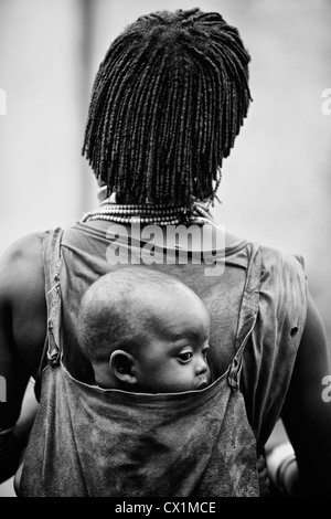 Woman of the Hamar tribe carrying child on her back, Omo Valley ...