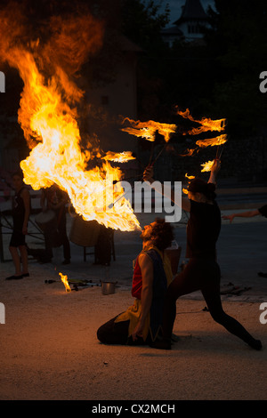 Performance of artists of the fire show in front of the public at the ...