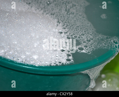bucket overflowing with hot soapy water Stock Photo - Alamy