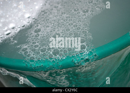 bucket overflowing with hot soapy water Stock Photo - Alamy