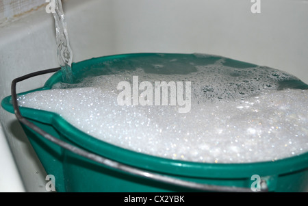 bucket overflowing with hot soapy water Stock Photo - Alamy
