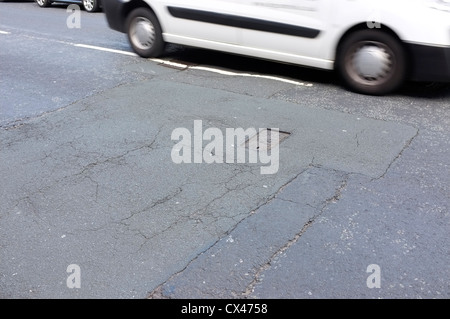 Potholes in roads in Leeds Stock Photo - Alamy