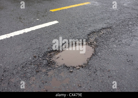 Potholes in roads in Leeds Stock Photo - Alamy