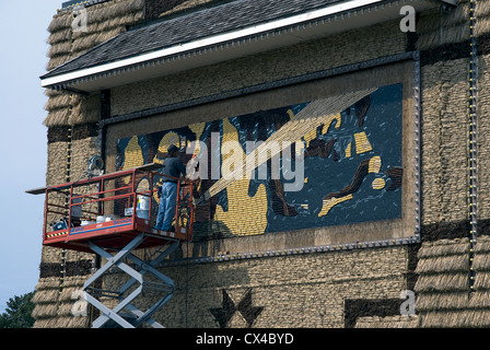 Decorating the coded mural at the Corn Palace Stock Photo - Alamy