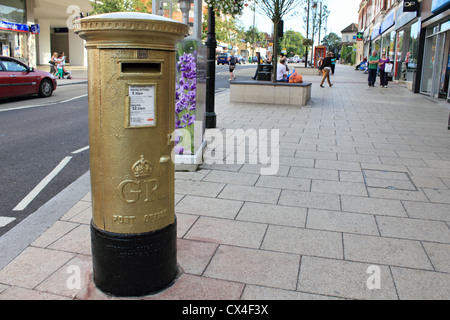Gold painted Royal Mail letterbox in the town of Leek celebrating the ...