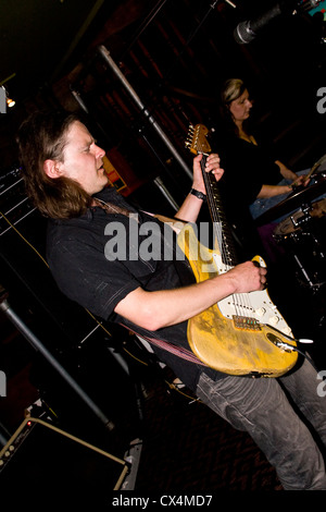 Lee Wharton of After Hours Blues Band playing the guitar behind his ...