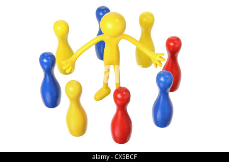 Miniature Rubber Figure with Bowling Pins Stock Photo - Alamy