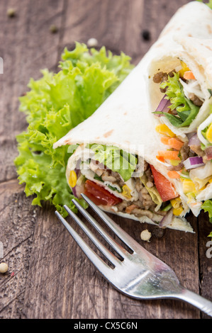 Some fresh made Wraps on wooden background Stock Photo - Alamy