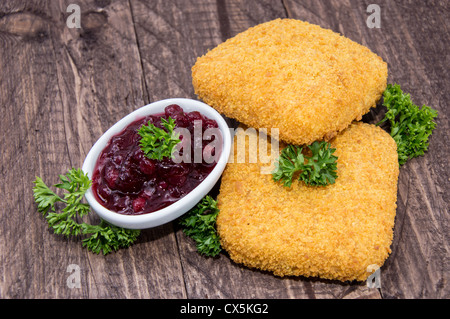 Portion of fried Gouda on wooden background Stock Photo - Alamy