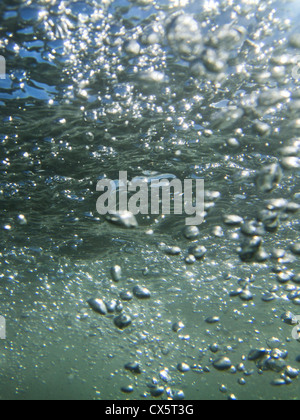 Bubbles made by a wave from below Stock Photo - Alamy