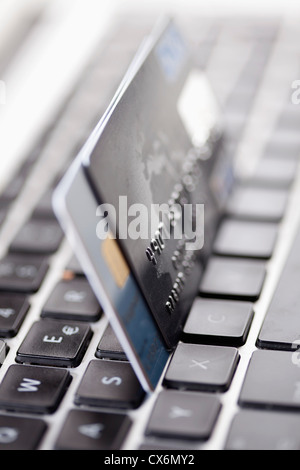 Credit cards on keyboard, close up Stock Photo - Alamy