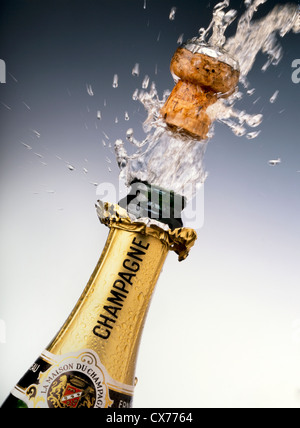 bottle of champagne with popping cork at new years 2017 Stock Photo - Alamy