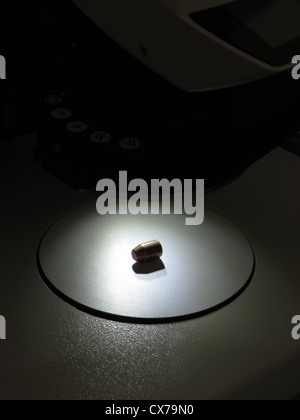 one bullet under a microscope at forensic lab at police event Stock ...