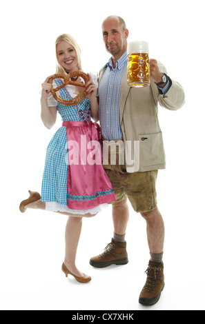 Pretty Oktoberfest woman with blue white dirndl holds a pretzel Stock ...