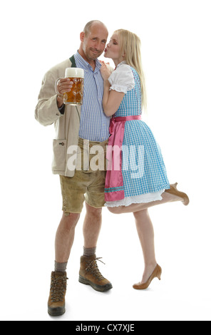 Pretty Oktoberfest woman with blue white dirndl holds a pretzel Stock ...