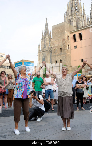 sardanas dancers are dancing to the music of the brass bands of ...