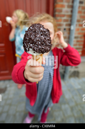 Soft vanilla ice cream with chocolate stick Stock Photo - Alamy