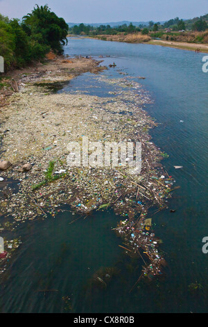 Trash floating in the river Stock Photo - Alamy