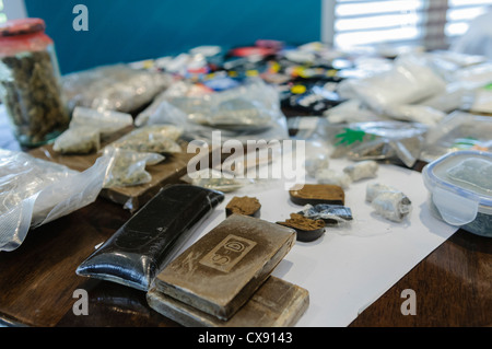 Blocks/bricks of cannabis resin on display with herbal cannabis, and ...