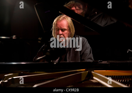 Portrait of Rick Wakeman playing grand piano, Marlowe Theatre ...