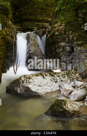 Waterfall in limestone gully at The Howk, Caldbeck, Lake District ...