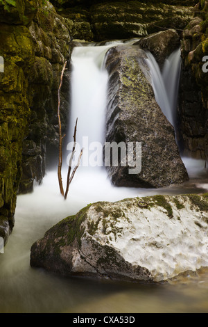 Waterfall in limestone gully at The Howk, Caldbeck, Lake District ...