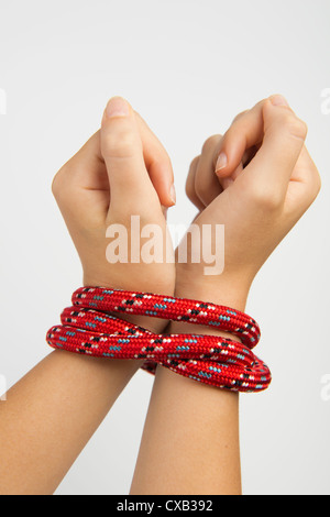 Woman tied with a rope by the hands, hanging Stock Photo - Alamy