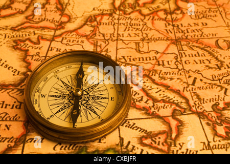 Compass and old map of Italy. Map is from 1680 and is out of copyright ...