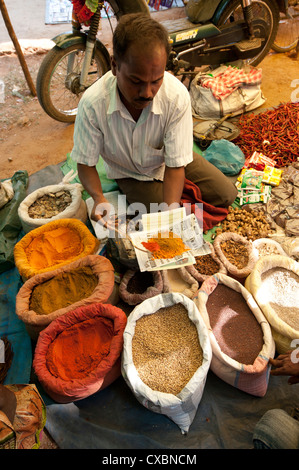 Desia Kondh tribal market stall, man selling sun dried river fish, near ...