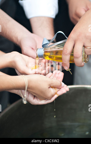 Priest giving a blessing at a baptism Stock Photo - Alamy