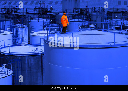 chemical plant process operator petro-chemical industry checking tower ...