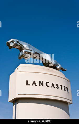 Iconic leaping Jaguar logo sculpture outside a showroom in Woodford ...