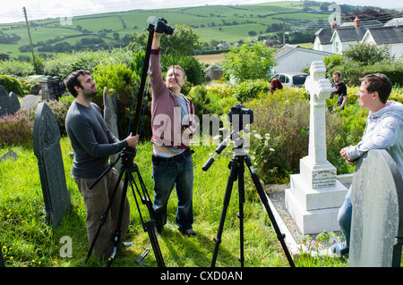 A small film crew making a short film using Canon DSLR cameras on a ...