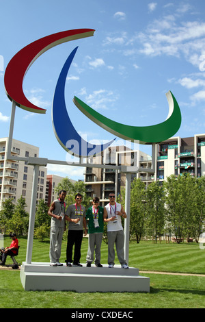 The Paralympic symbol, three "agitos" (Latin for "I move") is shown ...