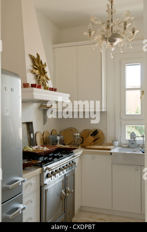 Hob and oven in fitted corner unit in modern kitchen Stock Photo - Alamy