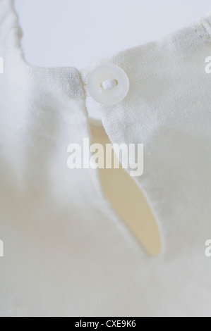 Button on clothes close up Stock Photo - Alamy