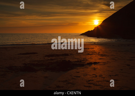 The Sun sets over Mwnt Stock Photo - Alamy