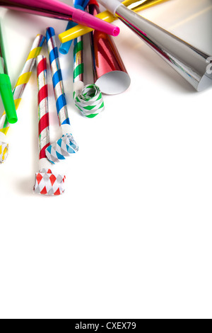 Party foil whistle or noise maker horn rolled isolated on the white ...