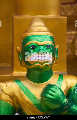 Myanmar, Burma, Yangon. A statue of the mythical creatures Kannari and ...