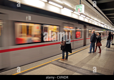 Passengers on the Austrian Metro system, Vienna, standing on a platform ...
