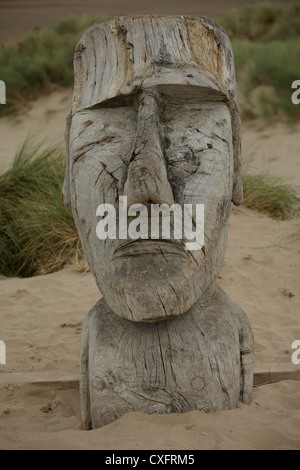 Wooden statue like the ones on Easter Island on the beach at Barmouth ...