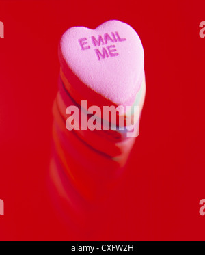 Stack of "Be My Love" candy hearts on pink. ©mak Stock Photo - Alamy