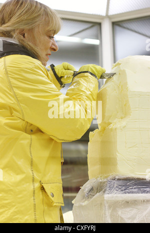 A butter sculptor at the Minnesota State Fair creating a sculpture of a ...